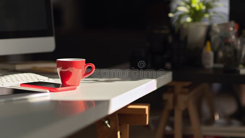 Red Coffee Cup on Computer Table with Smartphone and Supplies Stock ...