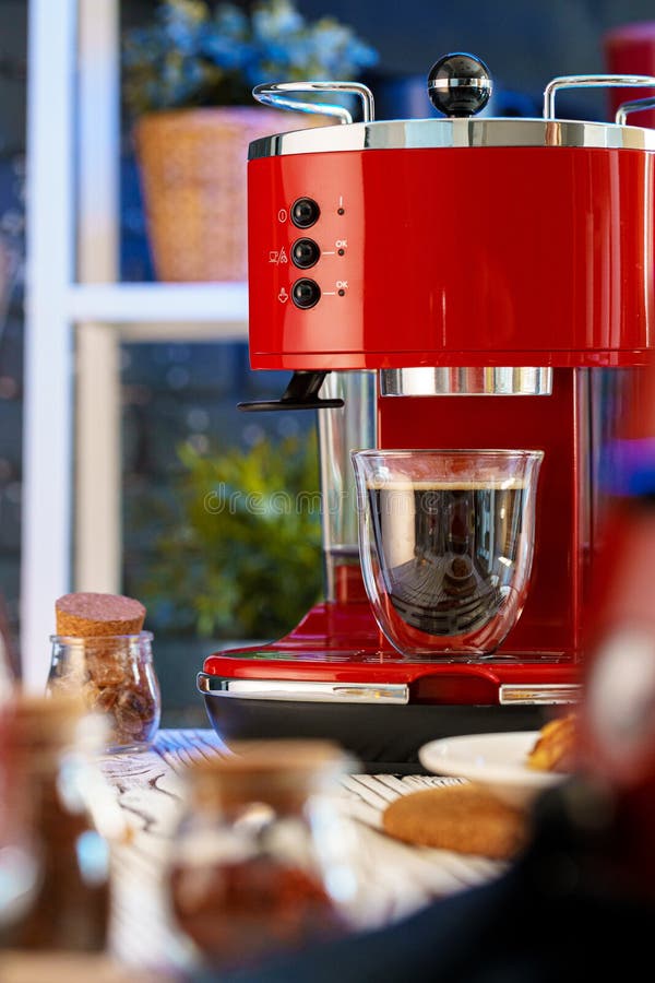 Red Coffee Machine with a Glass on Kitchen Counter Stock Image - Image ...