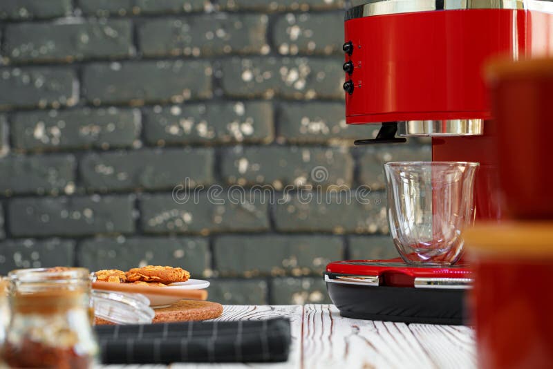 Red Coffee Machine with a Glass on Kitchen Counter Stock Image - Image ...