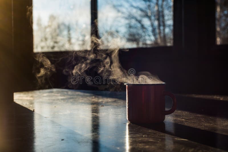 A Red Coffee Mug Sits on the Table, Steaming Stock Image - Image of ...