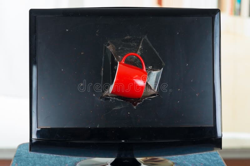 Red Coffee Mug Stuck Inside Black Broken Computer Stock Image - Image ...