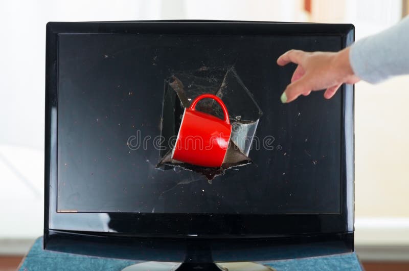 Red Coffee Mug Stuck Inside Black Broken Computer Stock Image - Image ...