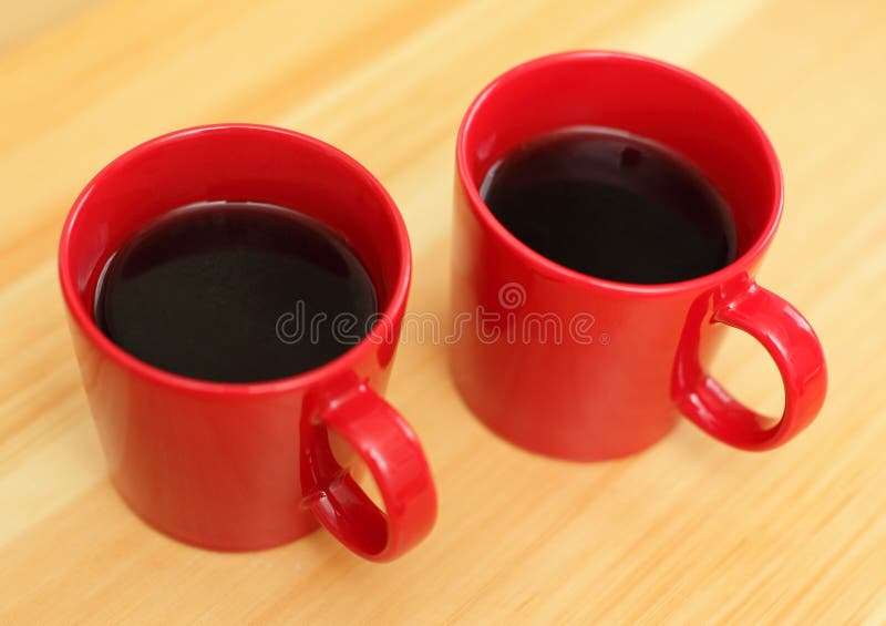 Red coffee mugs stock photo. Image of wood, black, table - 14008920