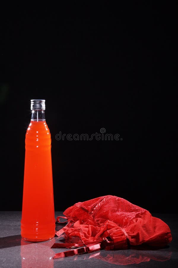 Red Coktail Bottle with Hand Bag Stock Photo - Image of drink, romantic ...