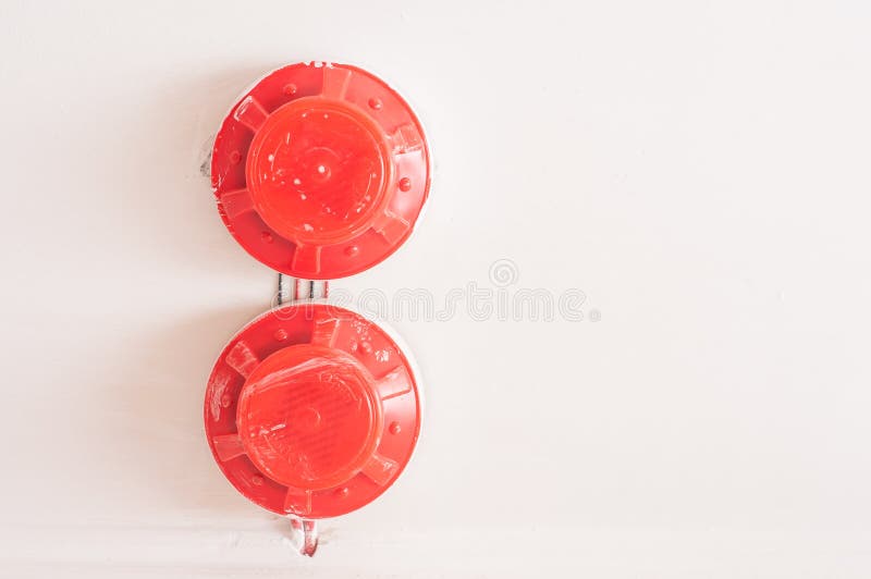 Red Color Fire Detector Mounted on the Ceiling. Sensor Triggered by ...