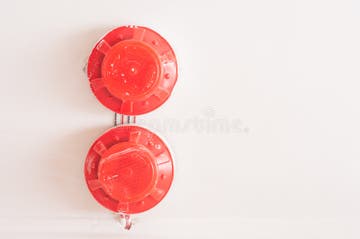 Red Color Fire Detector Mounted on the Ceiling. Sensor Triggered by ...