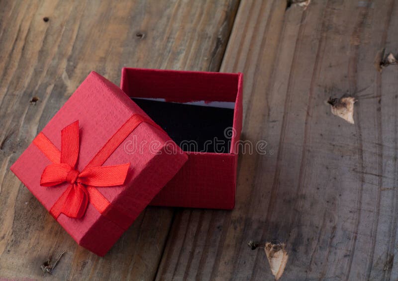 Red Color Gift Box with Bow on Wooden Background Stock Image - Image of ...