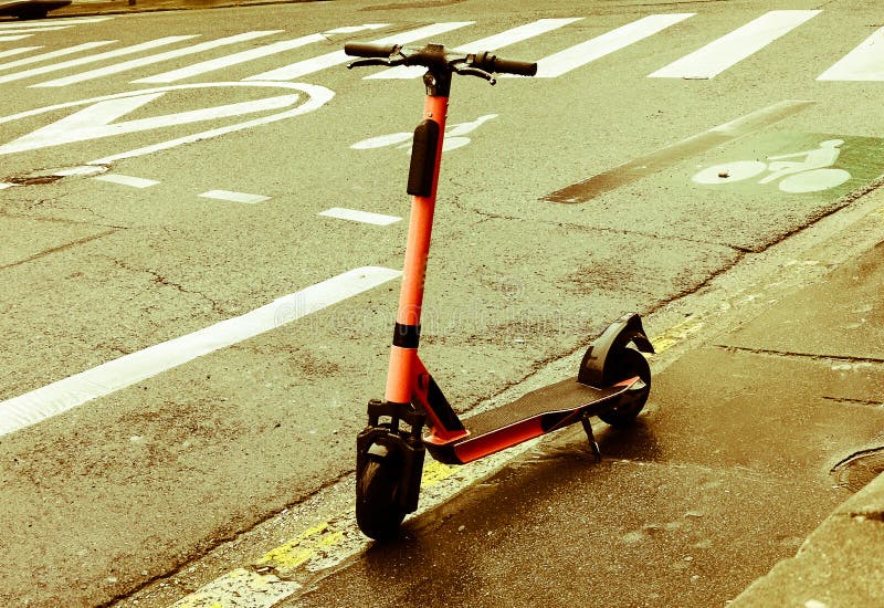 Red Color Rental Electric Scooter on the Sidewalk Stock Image - Image ...