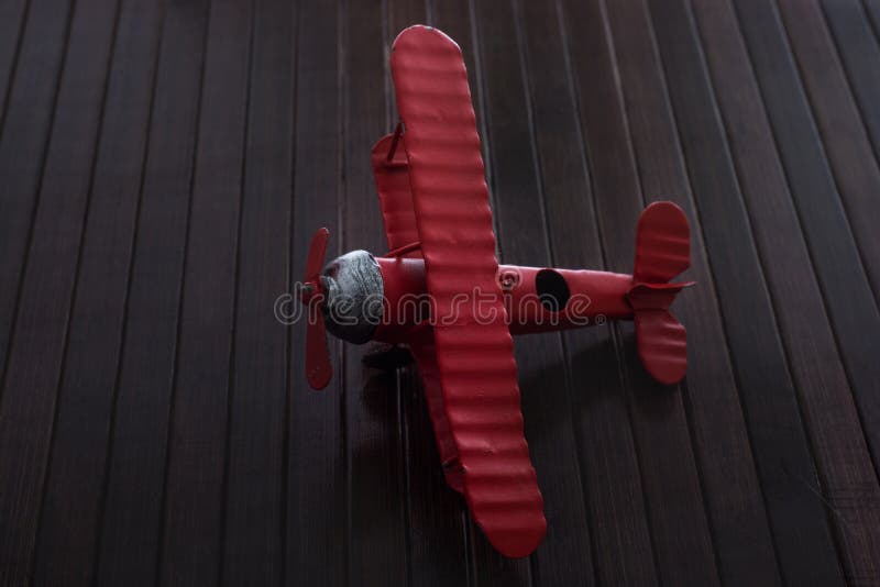 Red Color Toy Plane on Wooden Texture Stock Photo - Image of transport ...