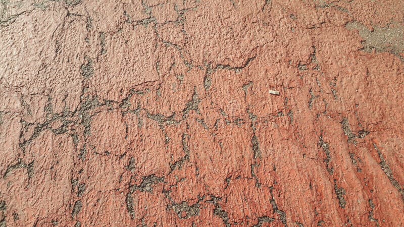 Red Colored Damaged Road or Paved Pathway with Crackes Stock Image ...