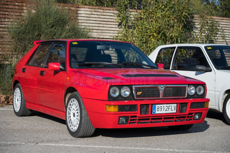 Red-colored Lancia Delta HF Parked on the Street Editorial Photography ...