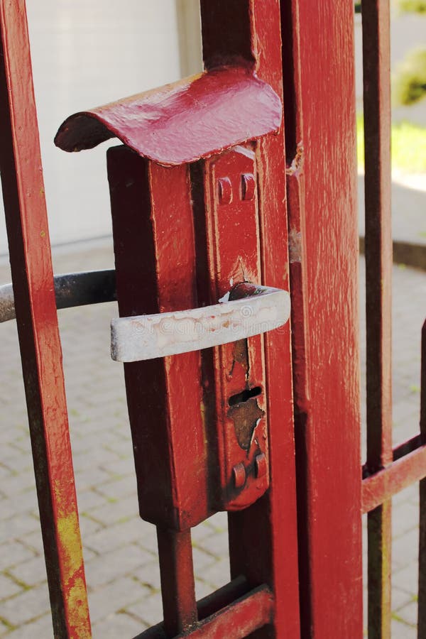 Red Colored Metal Gate Door Closed with Steel Door Handle Stock Photo ...