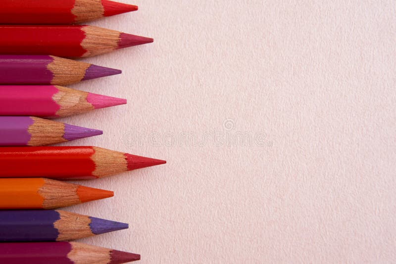 Red Colored Pencils Over a Pink Background. Stock Image - Image of ...