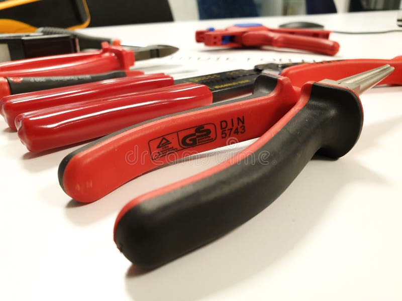 Red Colored Tools and Equipment in Office Setting Stock Image - Image ...