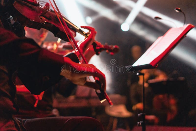 Red colored violin concert stock image. Image of hand - 166243607