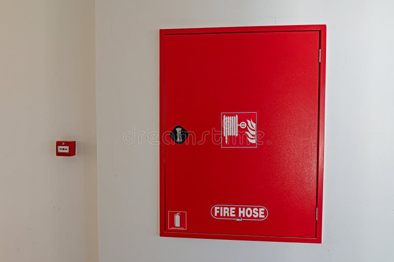 Red Coloured Fire Cabinet on the Wall Stock Photo - Image of ...