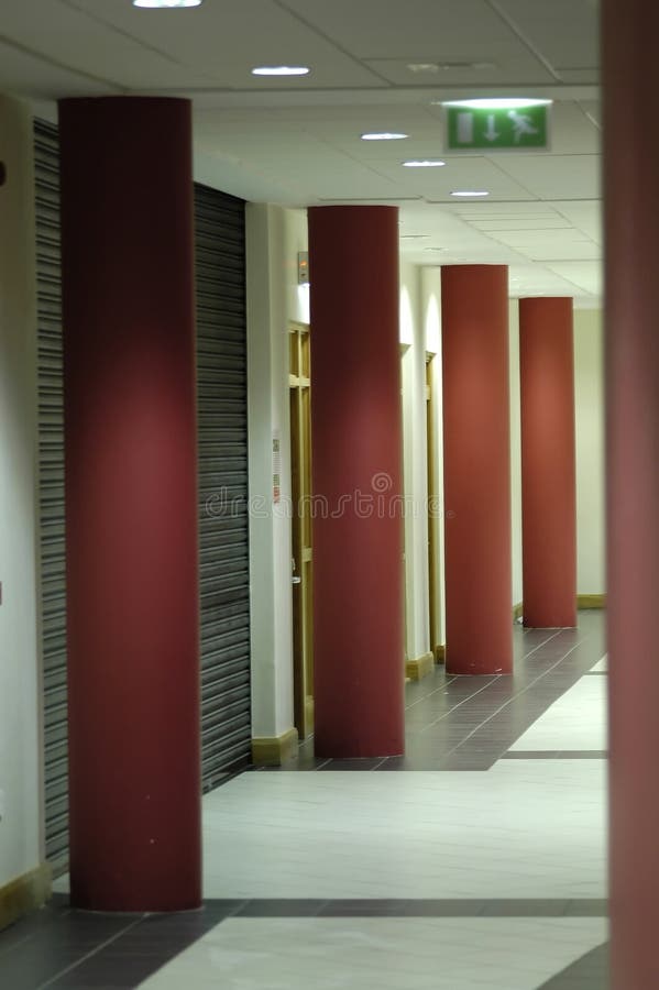Red Columns in Corridor stock image. Image of passage, lighting - 280907