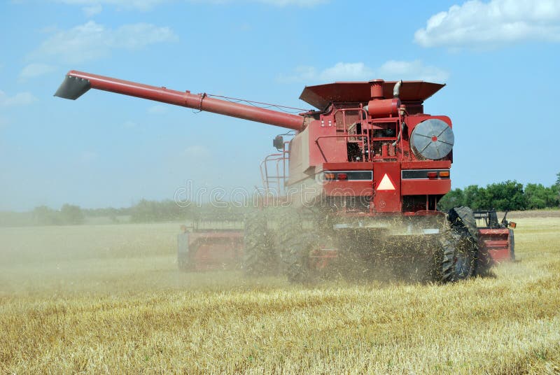 Red Combine Cutting Wheat stock image. Image of harvest - 16132853