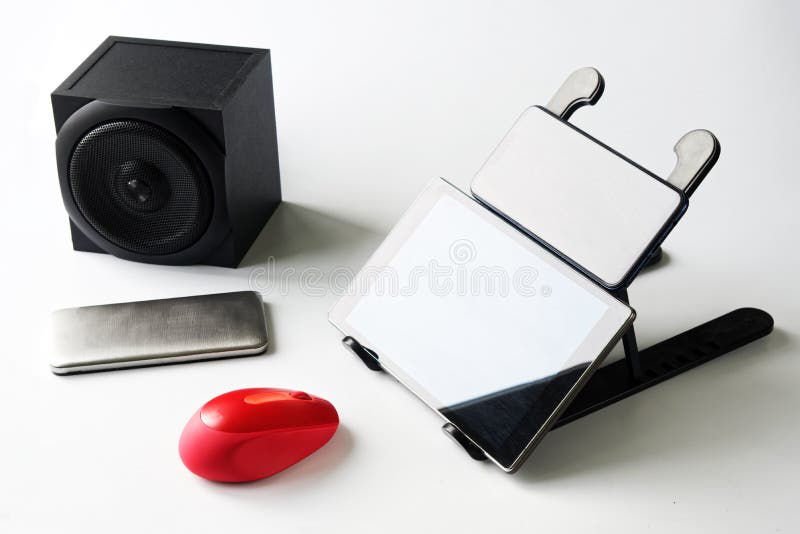 Red Computer Mouse, Smartphone and Tablet on Stand and Audio Speaker ...