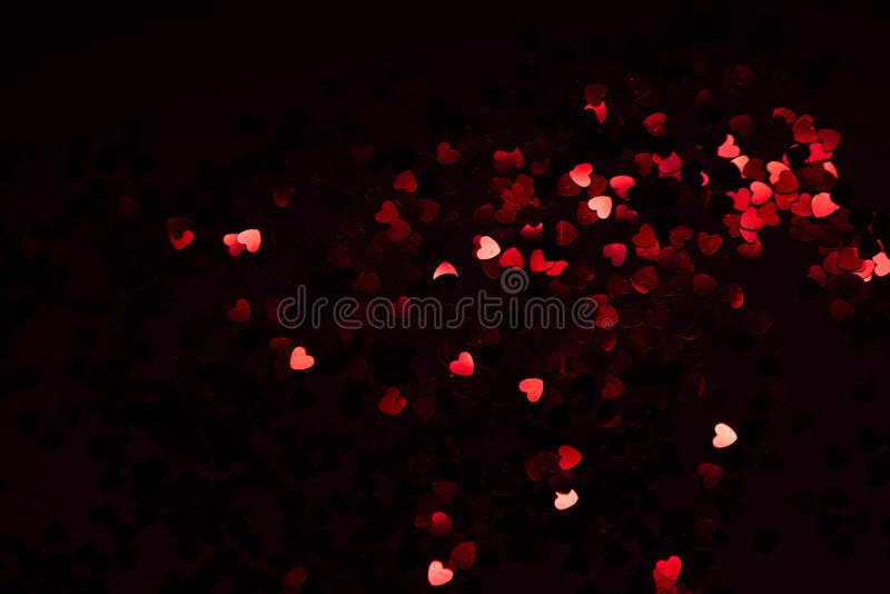 Red Confetti on a Black Background Stock Photo - Image of focus ...