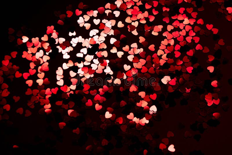 Red Confetti on a Black Background Stock Image - Image of selective ...