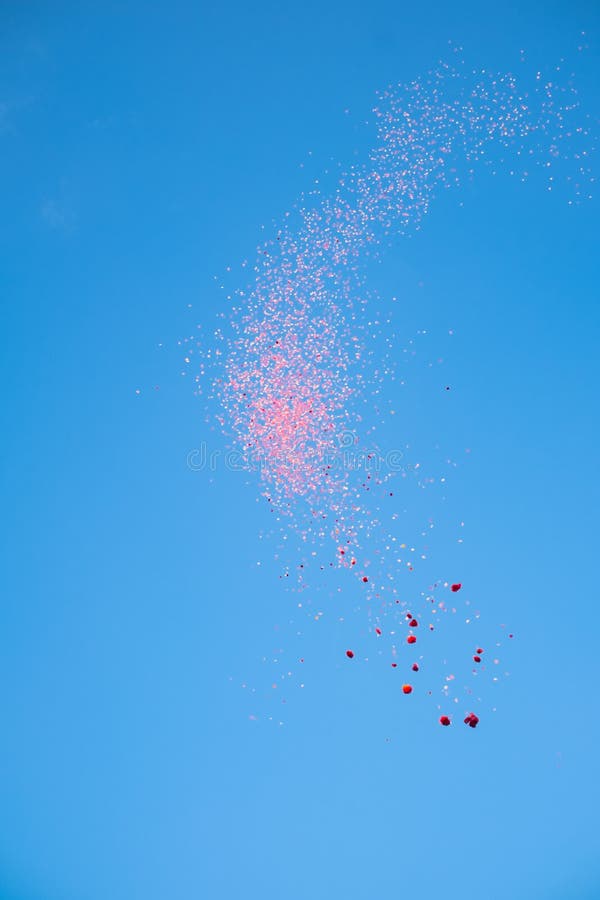 Red confetti in sky stock photo. Image of abstract, decoration - 180222214