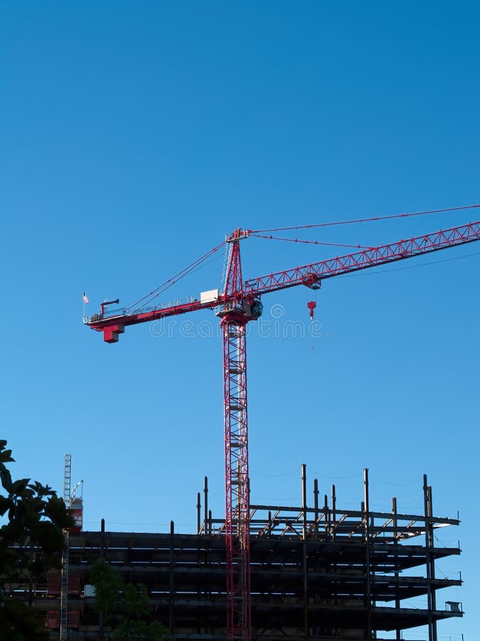 Red Construction Crane and Building Against Blue Sky Stock Image ...