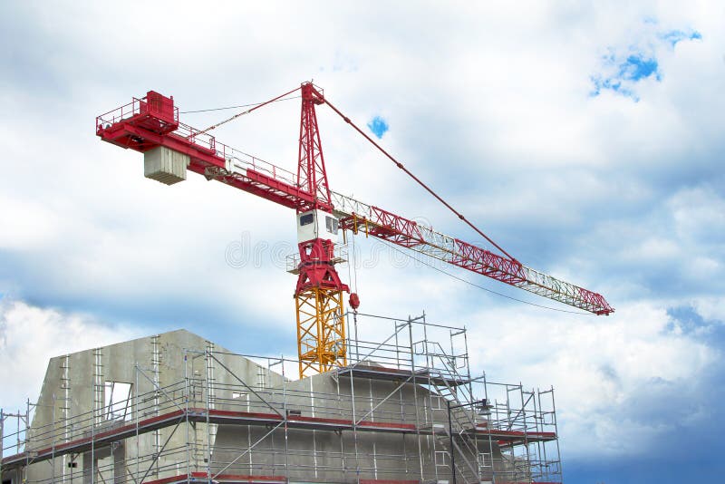 Red Construction Crane Over Bulding in Progress Against Blue Sky Stock ...