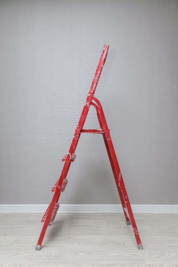 Red Construction Ladder, Stepladder on the Wall Stock Image - Image of ...