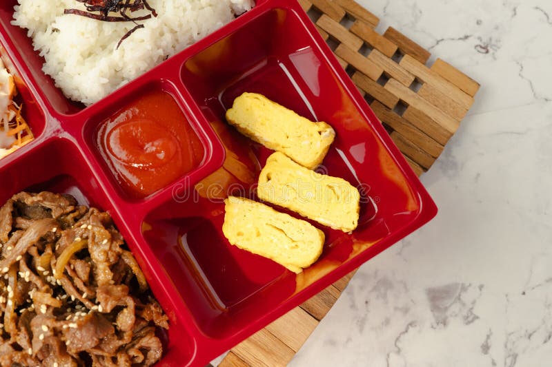 A Red Container with Rice and Meat Stock Photo - Image of gourmet ...