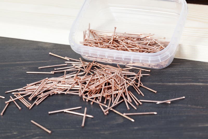 Red copper nails stock photo. Image of repair, heap - 129409632