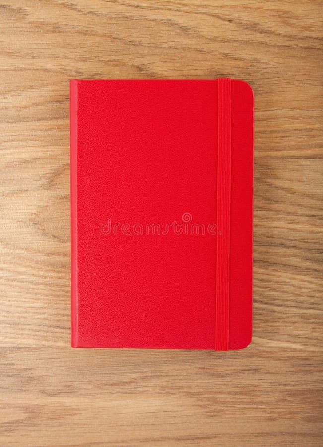 Red Copybook with Elastic Band on Wooden Background. Stock Photo ...