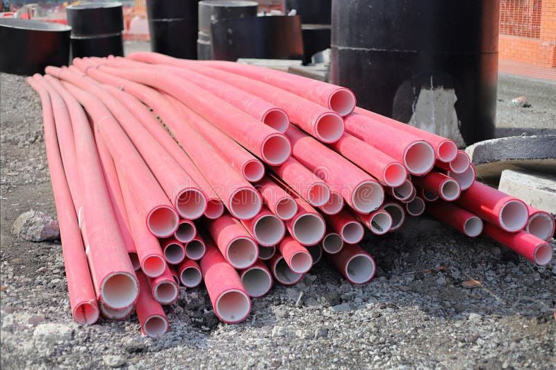 Red Corrugated Pipe for Wire at Construction Site. Cable Conduit for ...