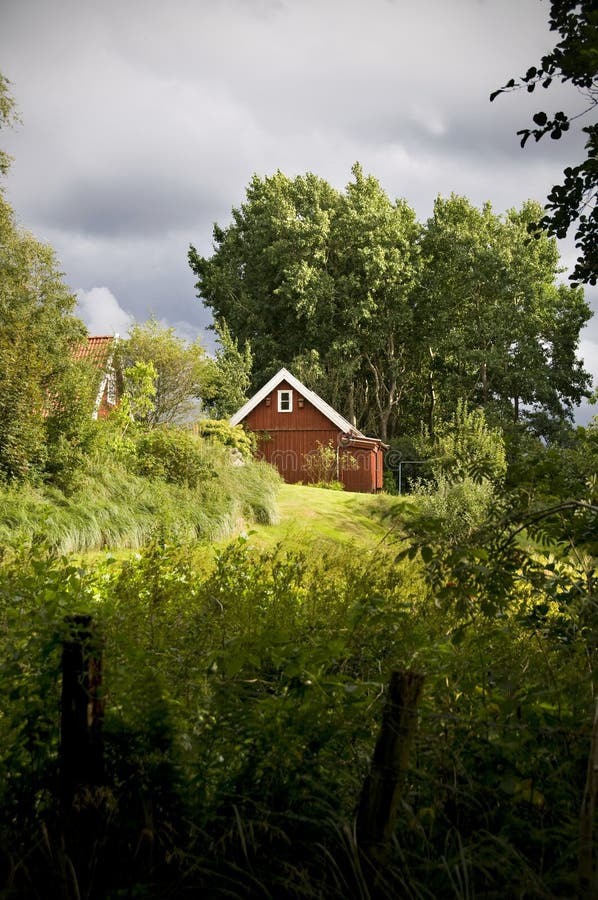 Red cottage stock photo. Image of sunlight, cloud, leaf - 12202062