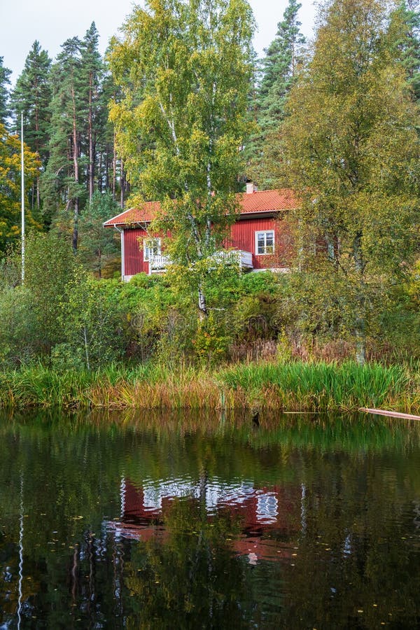 Red Cottage by a Forest Lake Stock Image - Image of outdoors, landscape ...