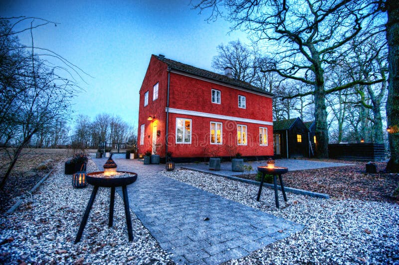 A red cottage at sunset editorial stock photo. Image of cottage - 30798398