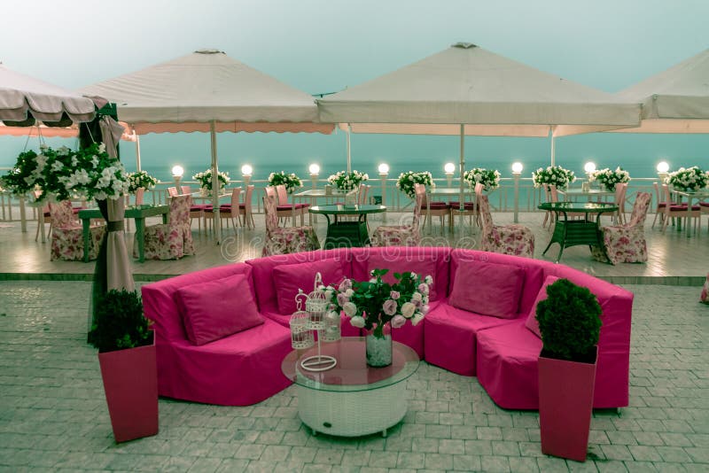 Red couch in a beach bar stock image. Image of luxurious - 162290605