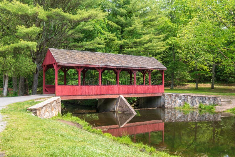 Red Covered Bridge Near a Forest Stock Image - Image of water, state ...