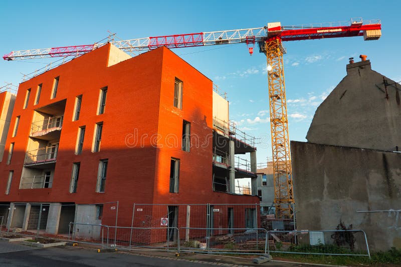 A Red Crane on a Construction Site Stock Photo - Image of crane ...