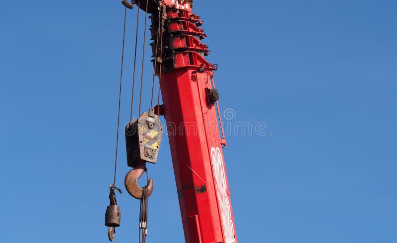 Red Crane Works in Construction Site with Hooks Stock Image - Image of ...
