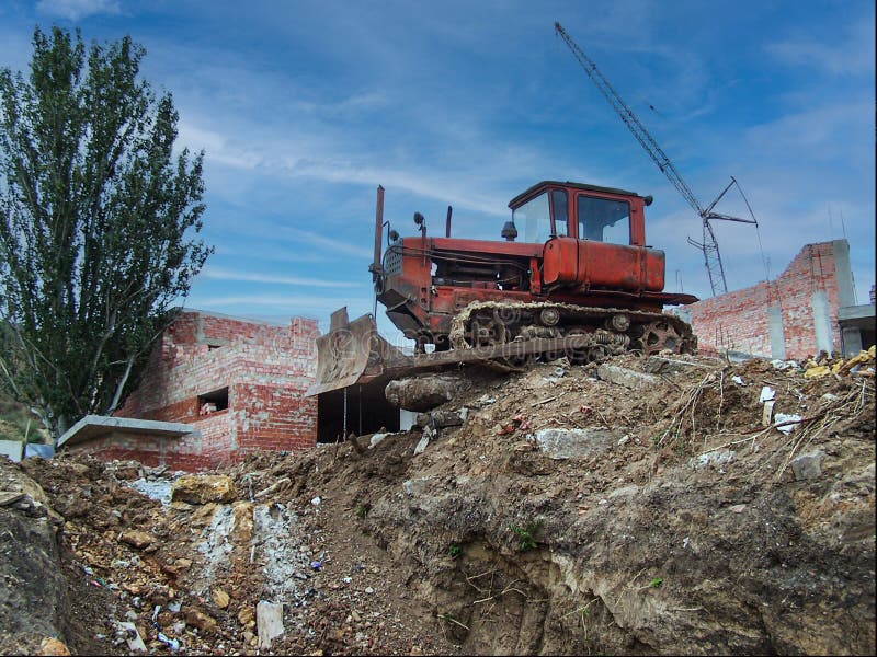 Red Crawler Bulldozer on Dirt and Rubble at Construction Demolition ...