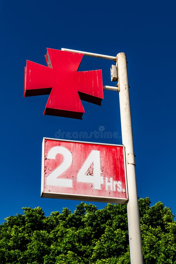 A Red Cross with the Number 24 Hours Written on it Stock Image - Image ...