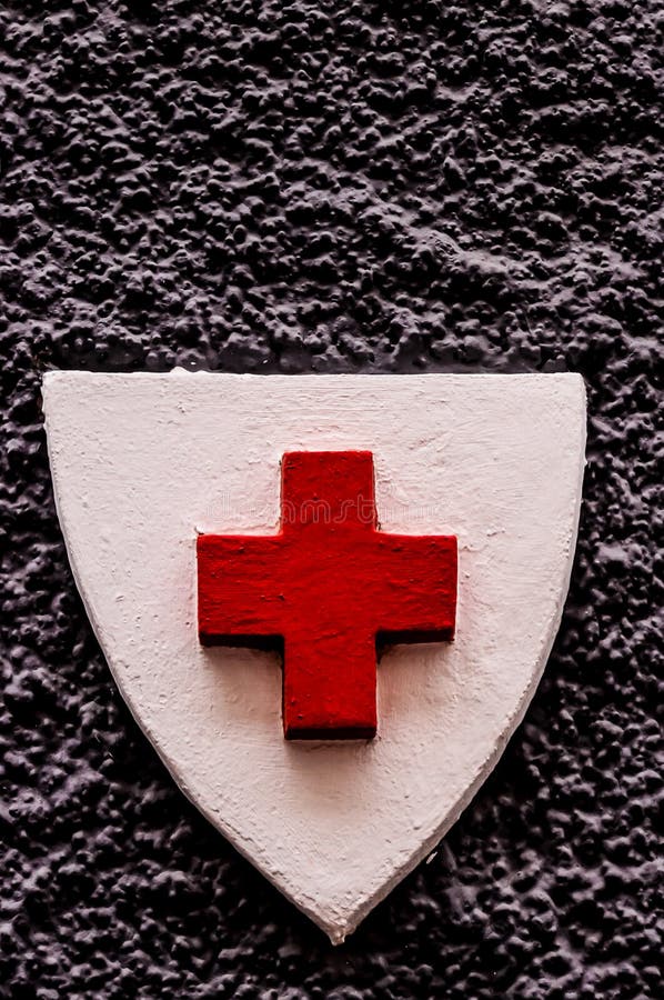 A Red Cross is on a White Shield Stock Image - Image of assistance ...