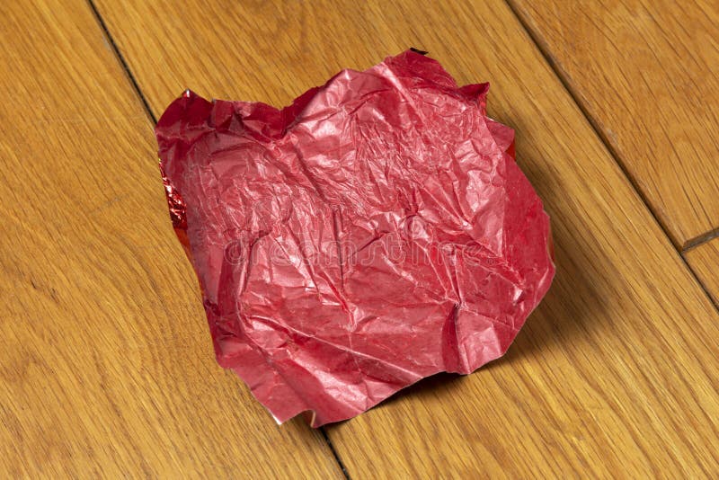Crumpled Red Candy Wrapper on the Floor Stock Photo - Image of creased ...