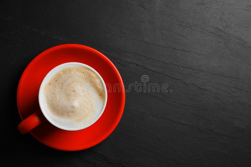 Red Cup with Aromatic Cappuccino on Black Textured Table, Top View ...