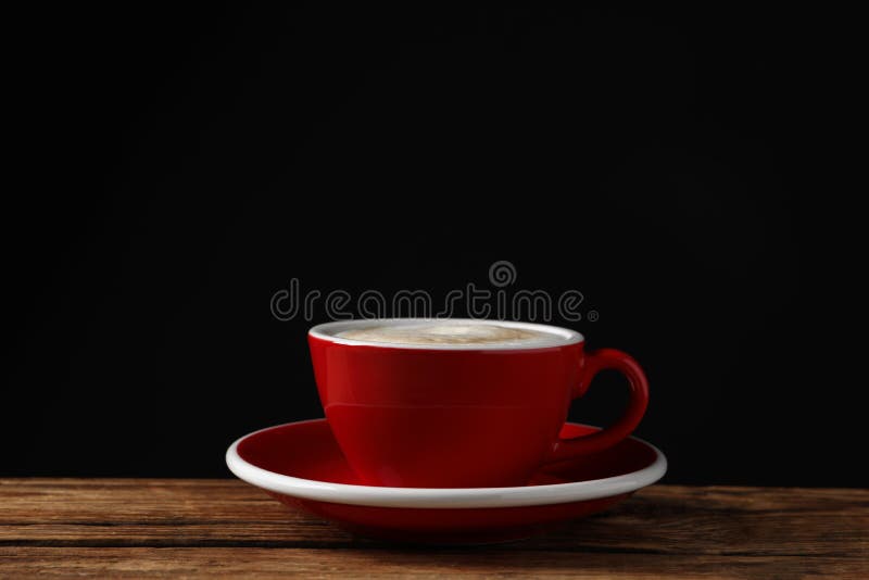 Red Cup with Aromatic Cappuccino on Wooden Table Against Black ...