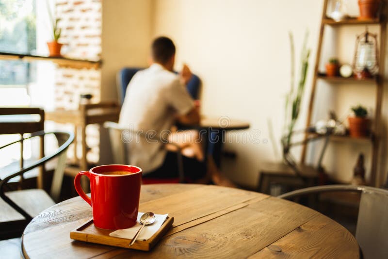 Red Cup of Coffee in a Cafe on Table. Place for Rest Stock Image ...