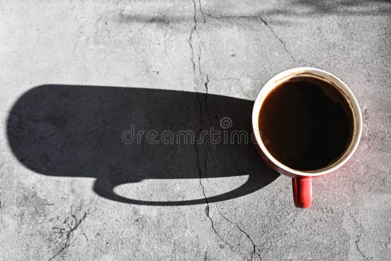 Red Cup with a Shadow. Long Shadow from a Cup of Coffee Stock Image ...