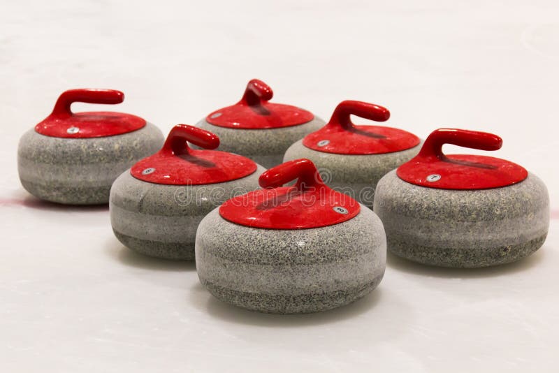 Red Curling Stones on Ice stock image. Image of reflection - 158901089