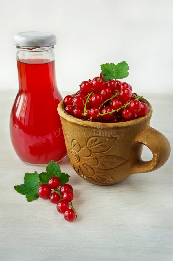 Red Currants in a Clay Cup and a Bottle of Juice Stock Photo - Image of ...